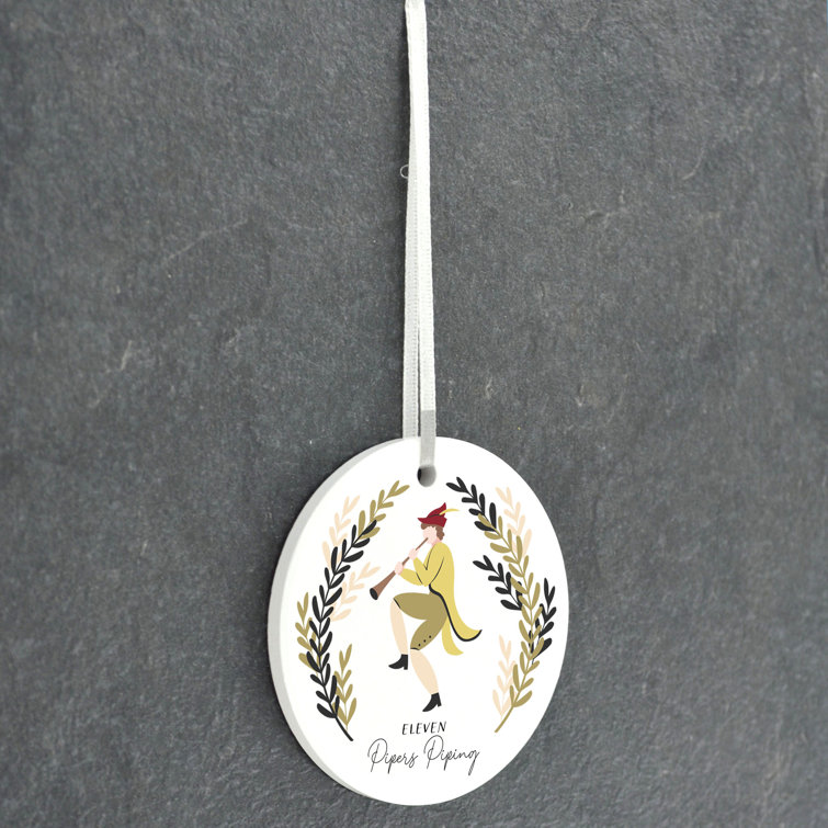 Happy Larry Sanson 12 Days 11 Pipers Piping Circle Shaped Ceramic Ornament | Wayfair.co.uk